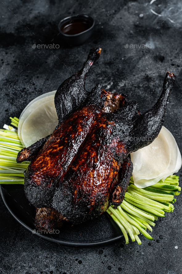 Traditional whole roasted Christmas Peking duck with herbs and sauce ...