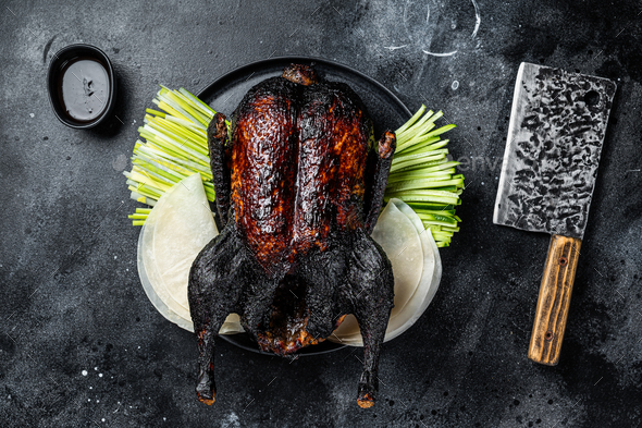 Traditional whole roasted Christmas Peking duck with herbs and sauce ...