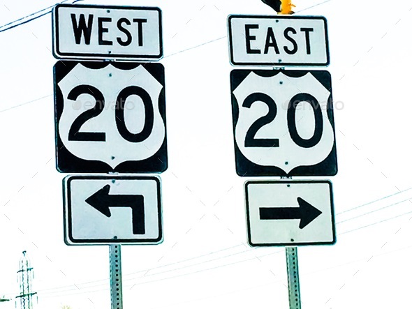 Two 20 20 highway directional double road signs with arrows pointing ...