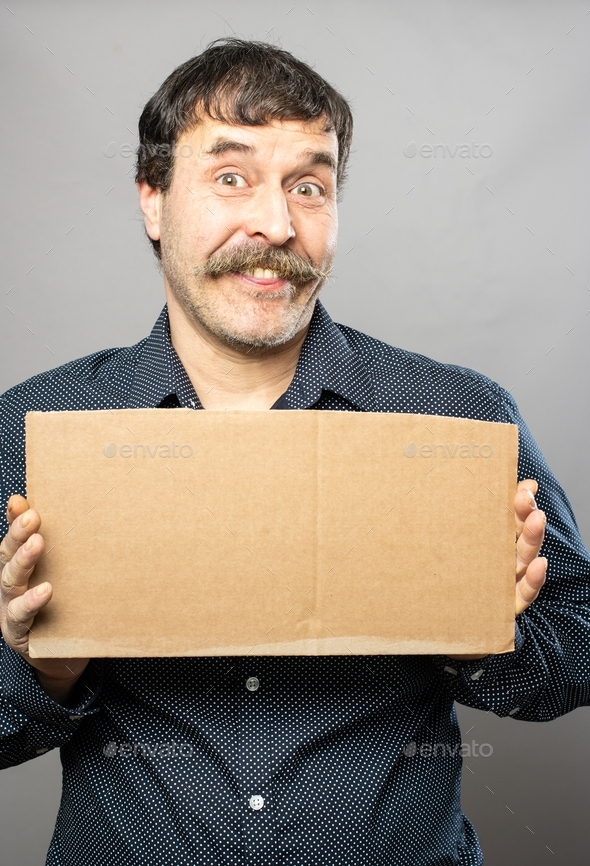 Silly moustache man with card board sign, studio portrait series on ...