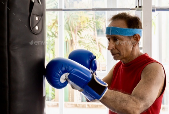 Active senior boxing for a healthy lifestyle Stock Photo by lucky_ch