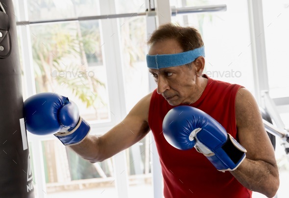 Active senior boxing for a healthy lifestyle Stock Photo by lucky_ch