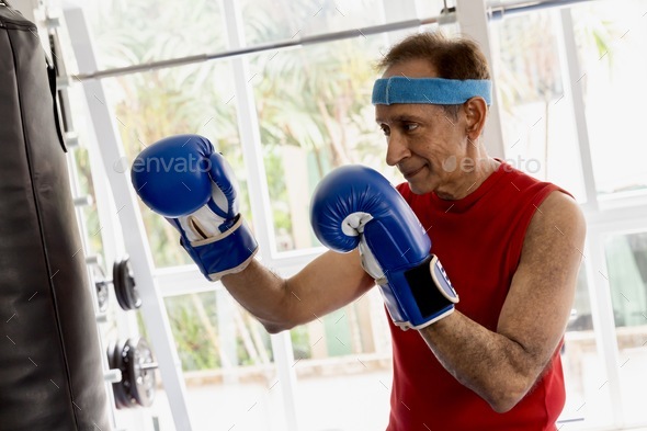 Active senior boxing for a healthy lifestyle Stock Photo by lucky_ch