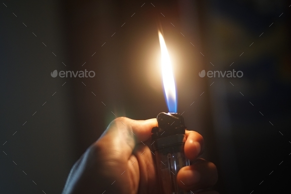 lighting a lighter Stock Photo by Wdnld | PhotoDune