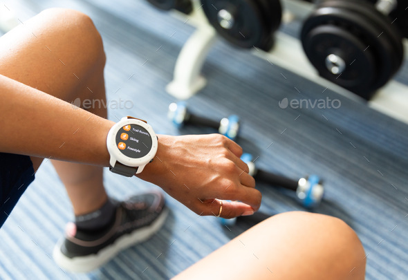 Using a smart watch at the gym, tracking calories and steps; weight ...