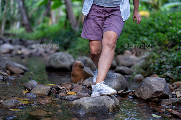 photo shot on backpack hiking traveler foot and leg walk step across on ...