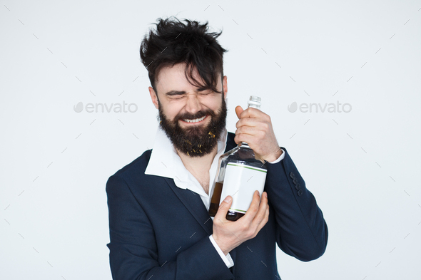 Drunk man with a bottle of alcohol on white background Stock Photo by ...