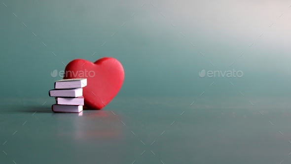 Stack of books and red heart with copy space for text Stock Photo by ...