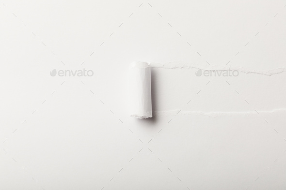 torn paper with rolled edge on white background Stock Photo by ...