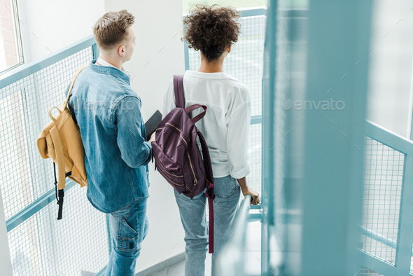 back view of two international students with backpacks Stock Photo by ...