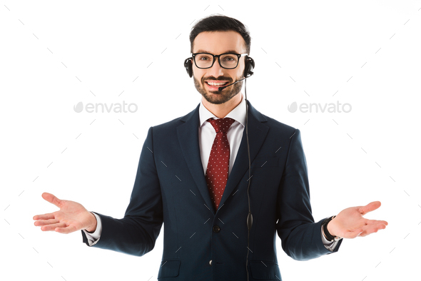 handsome call center operator in headset smiling and showing idea ...