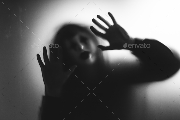 Shadowy figure behind glass - horror background Stock Photo by erika8213