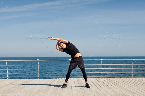 Man bending on pier Stock Photo by kegfire | PhotoDune