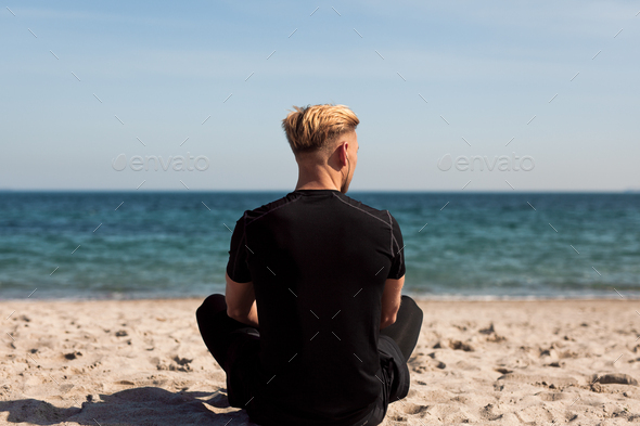 Man sitting on the beach Stock Photo by kegfire | PhotoDune