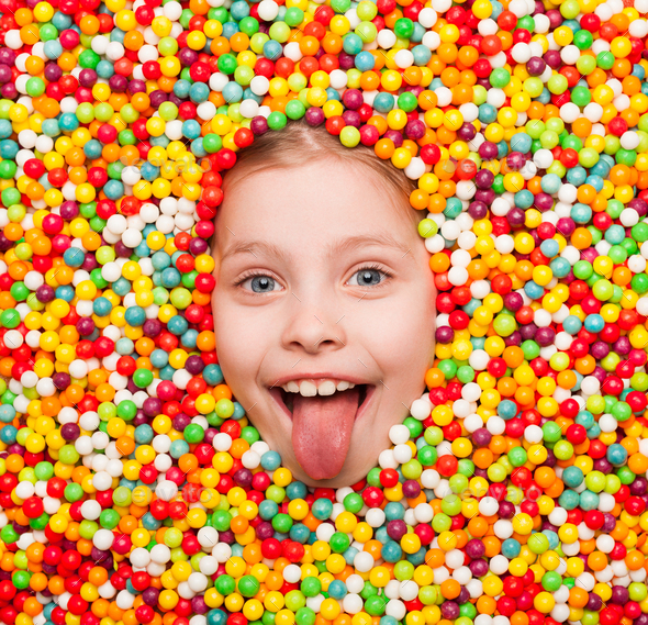 Lovely kid posing in candies Stock Photo by kegfire | PhotoDune