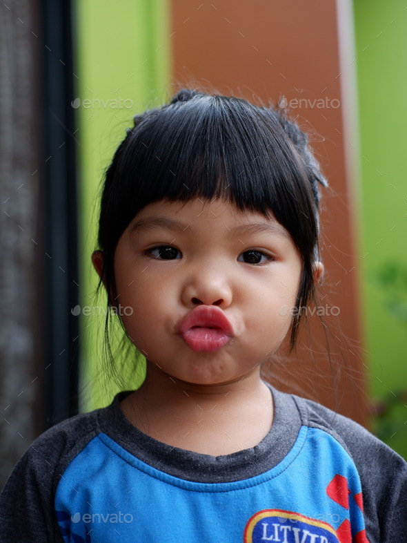 Duck face of cute little girl Stock Photo by Achievictor | PhotoDune