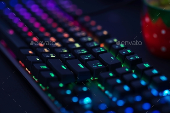 Close up of Computer RGB gaming keyboard, Illuminated by colored LED ...