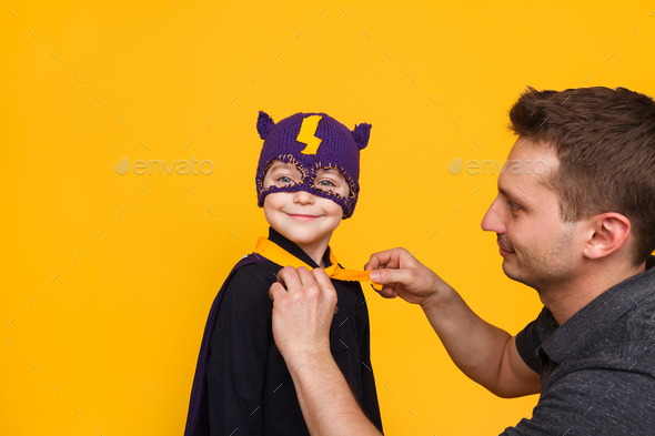 Man helping boy to put on costume Stock Photo by kegfire | PhotoDune