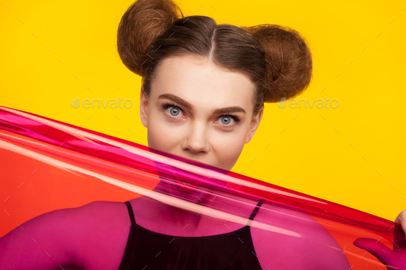 Expressive model with piece of plastic fabric Stock Photo by kegfire