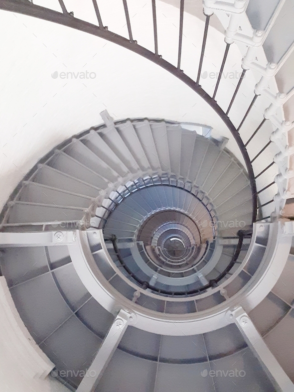 Steep spiral staircase of the Ponce Inlet Lighthouse taken from below ...
