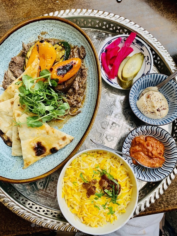 Mediterranean meal of lamb basmati rice and turnips and hummus on a ...