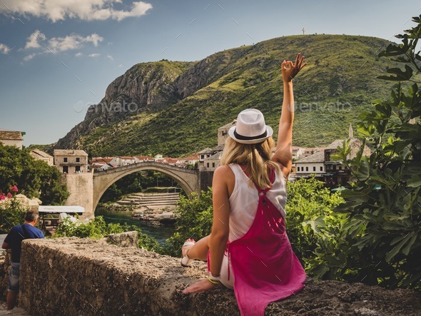 Travel girl celebrates in Mostar Stock Photo by slovoflud | PhotoDune