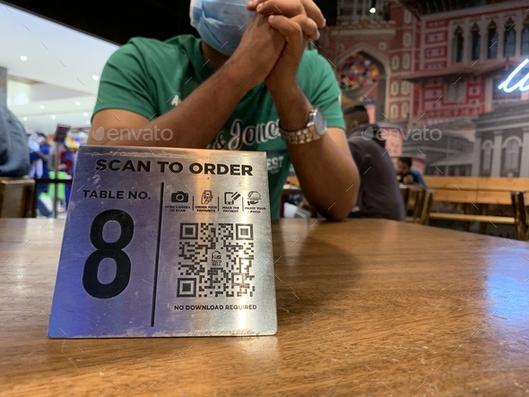 Waiting in a restaurant. Table has qr code for easy orders Stock Photo ...