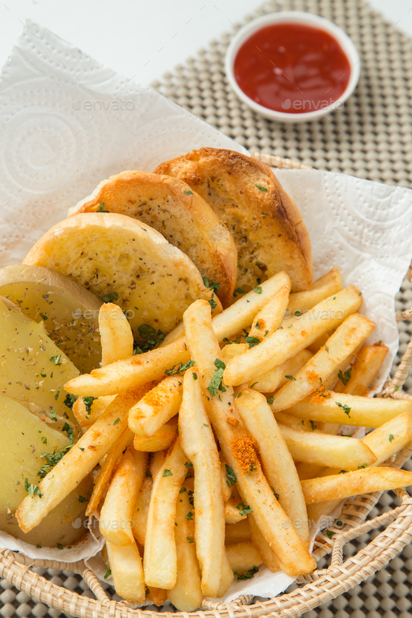 Traditional French fries with ketchup and bread Stock Photo by FamilyStock