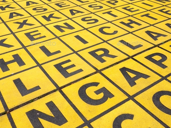 Yellow letters on an asphalt ground in Berlin Stock Photo by wouterkuin