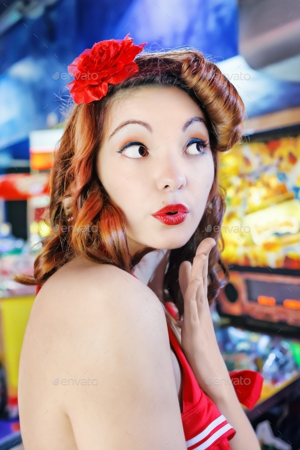 Pin-up girl kiss. Portrait of girl in pin-up style that blows a kiss ...