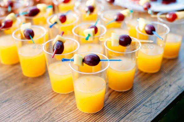 Row line of different alcohol and non-alcohol cocktails. cocktails with ...