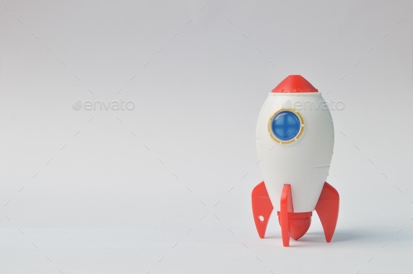 Toy rocket isolated on a white background Stock Photo by innu_asha84