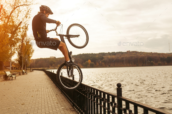 Male performing tricks with bike Stock Photo by kegfire | PhotoDune
