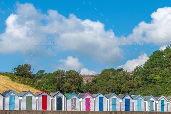 Colorful small beach houses. Multicolored beach sheds. Variety of ...