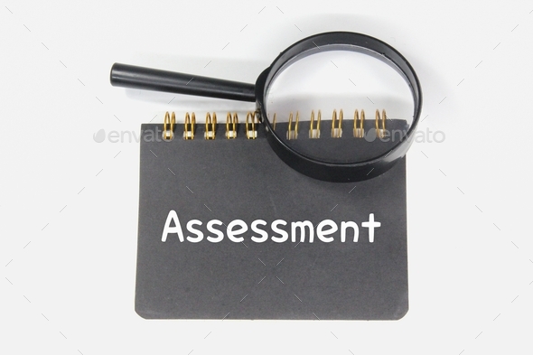 magnifying glass, notebook and word assessment Stock Photo by fauziEv8