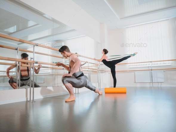 Preparation of body before performance in ballet studio Stock Photo by ...