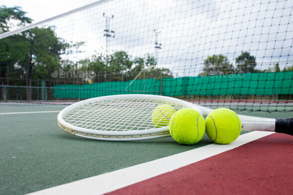Close up view of tennis racket and balls on the tennis court Stock ...