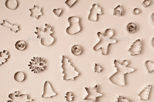 Christmas cookie cutters background. Festive baking Stock Photo by OksaLy