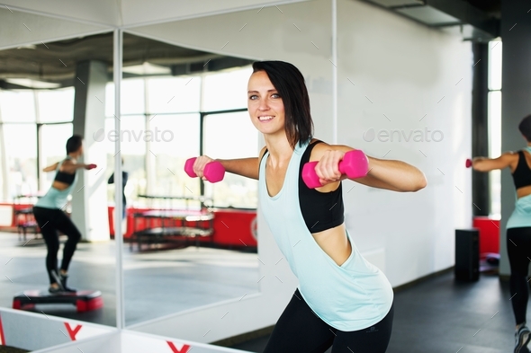 Fitness trainer shows an exercise in the group training room Stock ...
