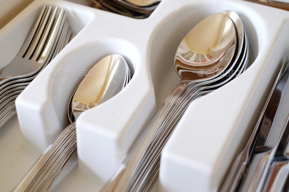 Detail picture of spoons and forks in a kitchen drawer Stock Photo by ...