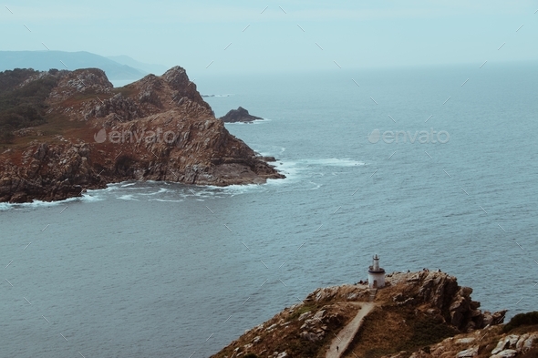 View from above of a Lighthouse in an island. Stock Photo by kelsen06