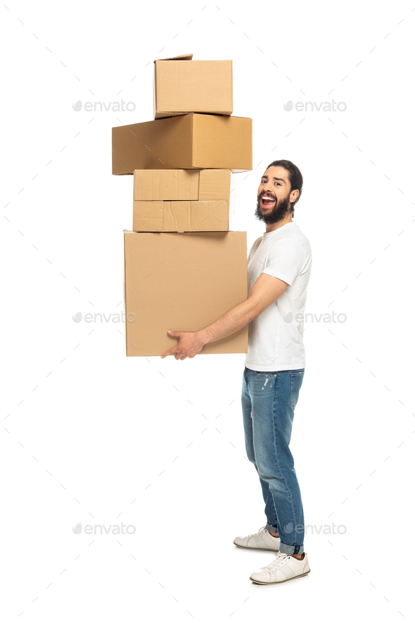 cheerful latin man holding carton boxes and smiling isolated on white ...