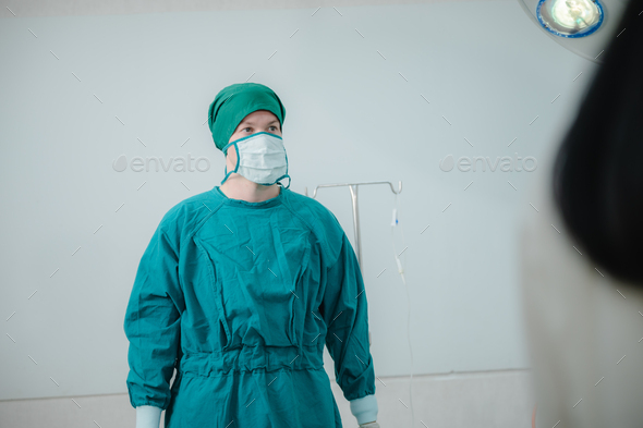 surgical doctor person are wearing protected suit medical operation ...