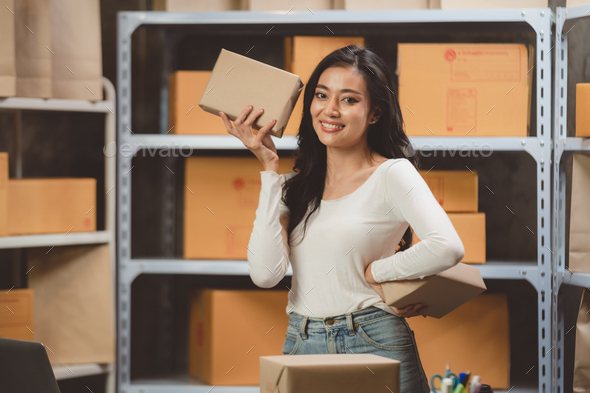woman entrepreneur's hand holding package of parcel box, Preparing pack ...