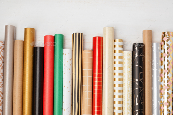 Christmas background with rolls of wrapping paper. Xmas celebration ...
