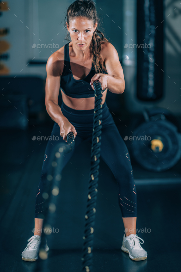 Agility training, woman exercising with rope in a gym. Stock Photo by ...