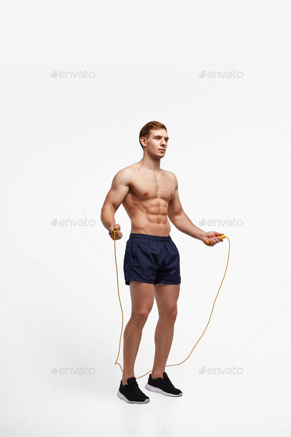 Sportive man jumping rope Stock Photo by kegfire | PhotoDune