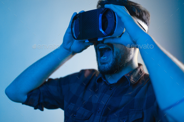 Screaming man wearing VR goggles Stock Photo by kegfire | PhotoDune