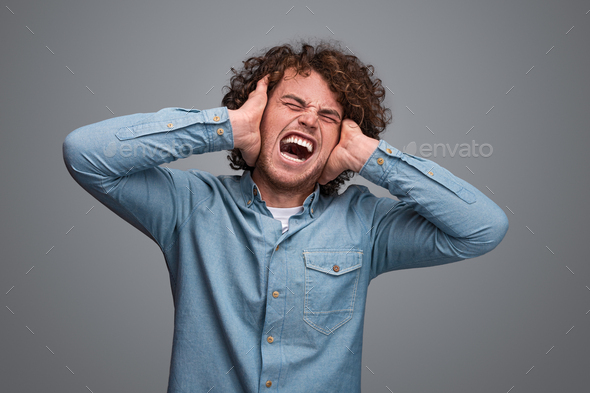 Man covering ears and screaming Stock Photo by kegfire | PhotoDune