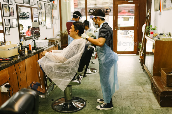 New Normal at barber shop A barbers apply new normal in his barber shop ...